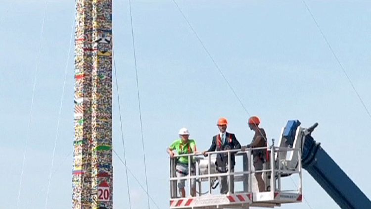 Scaling new Lego heights: children build world's tallest tower in Milan ...