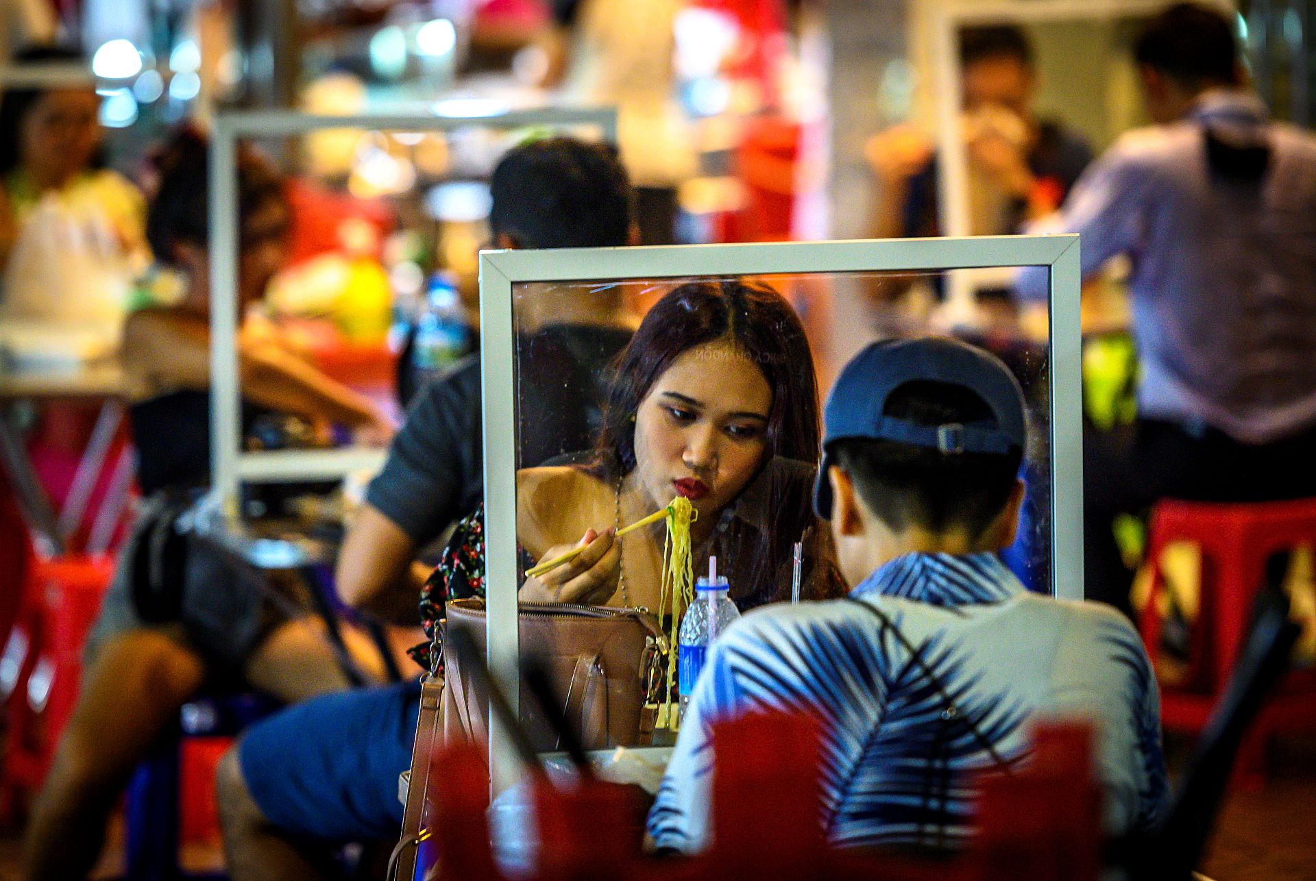 In pictures: Restaurants find creative ways to enforce social ...