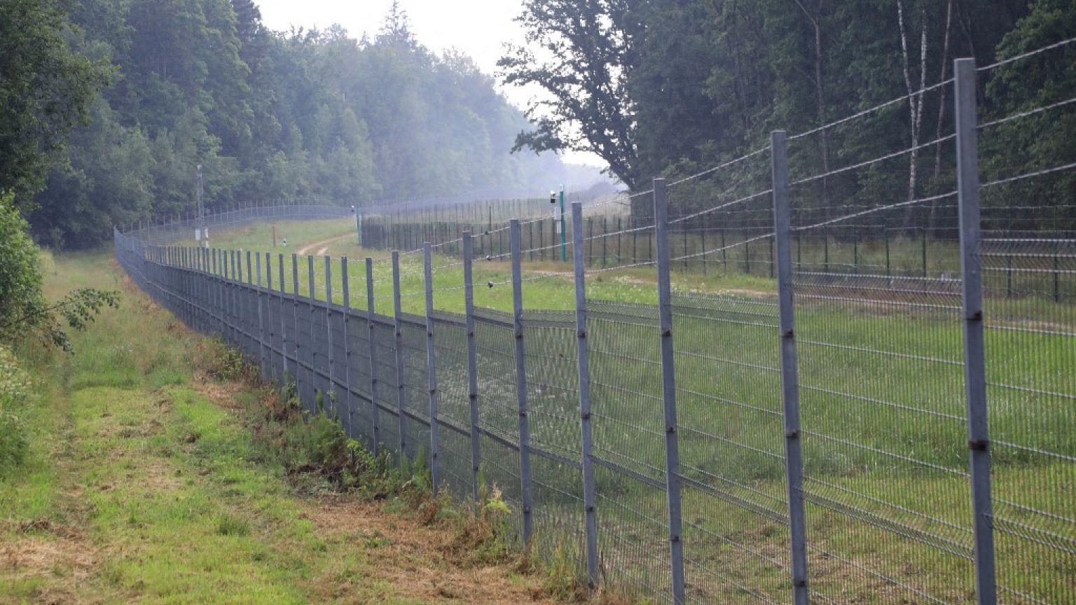 Lithuania begins building Belarus border fence to deter migrant ...