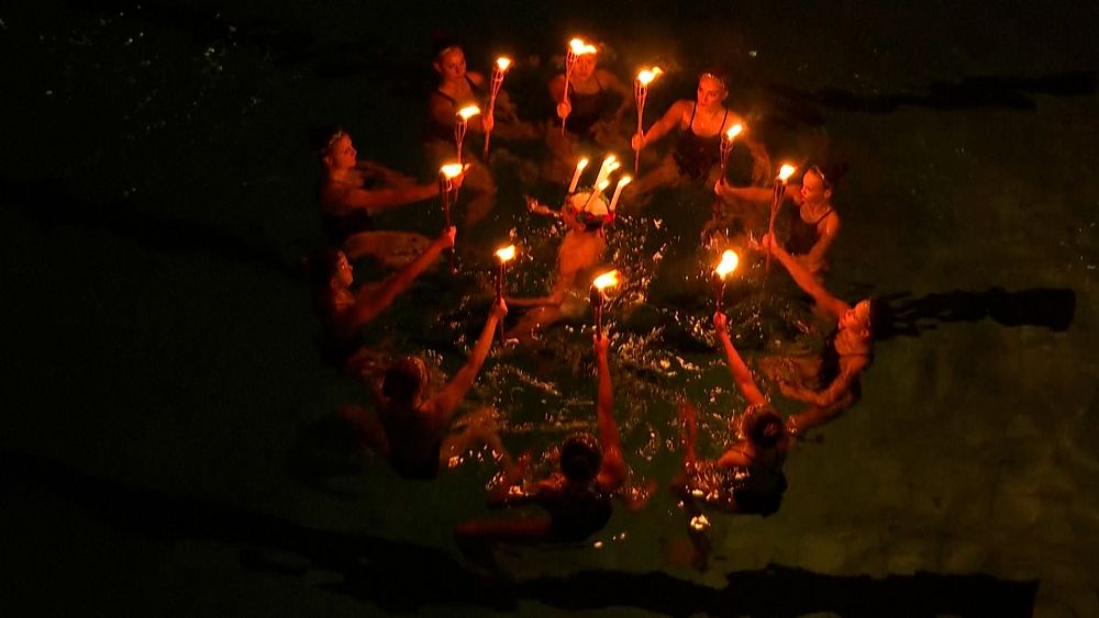 Lights dazzle in swimming pool to celebrate festive Santa Lucia Day in ...