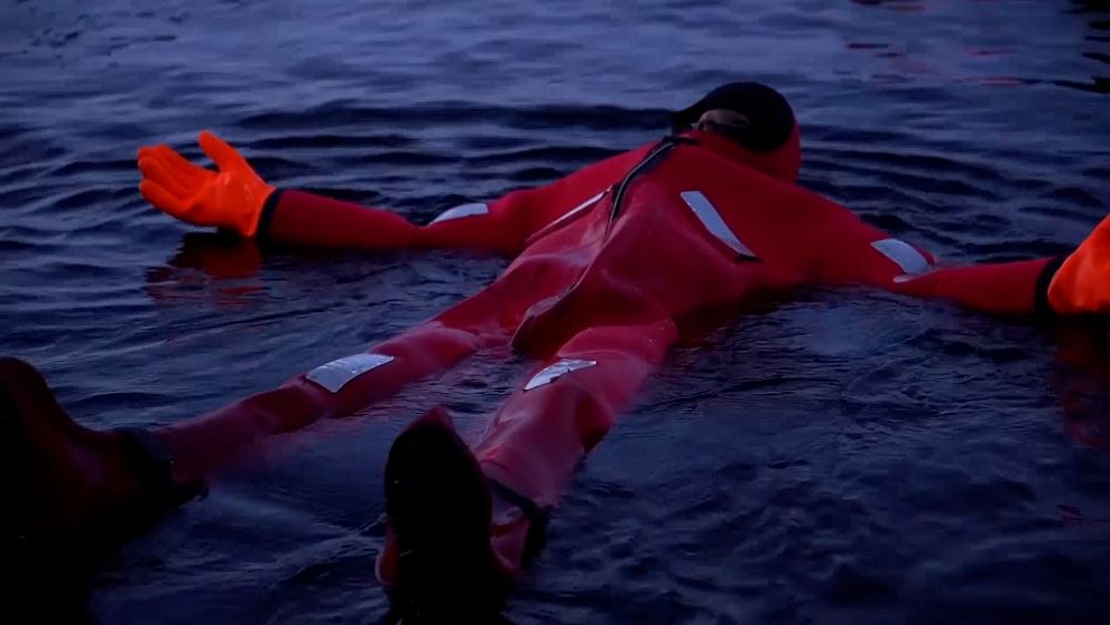 Arctic Ice Floating: Would you brave a swim in a frozen lake in Lapland ...