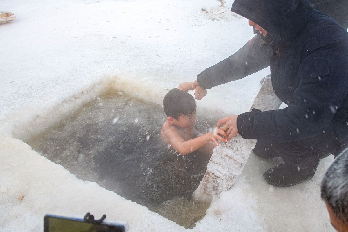 In pictures: Russian Christians plunge into icy water to mark Epiphany ...