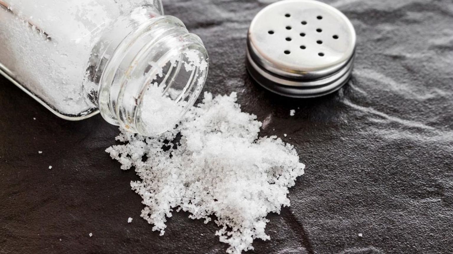 Sprinkling extra salt over your food could ‘knock two years off your ...