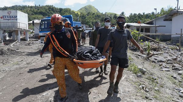 Philippines storm victims 'feared tsunami and ran toward mudslide ...