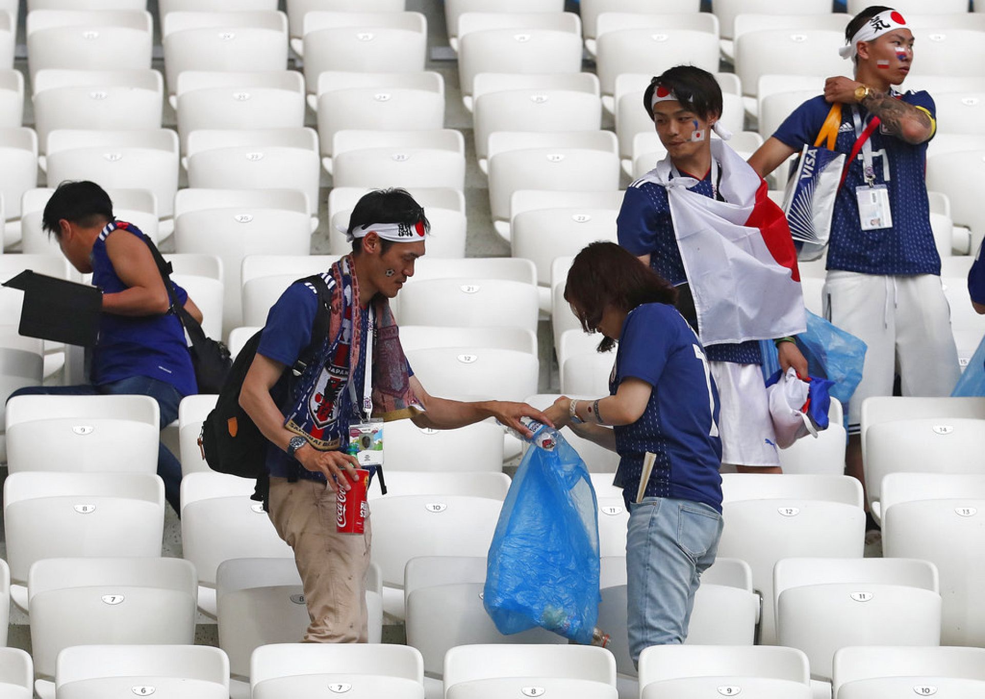 Keep Qatar Tidy: Japan's rubbish collecting football fans become World ...