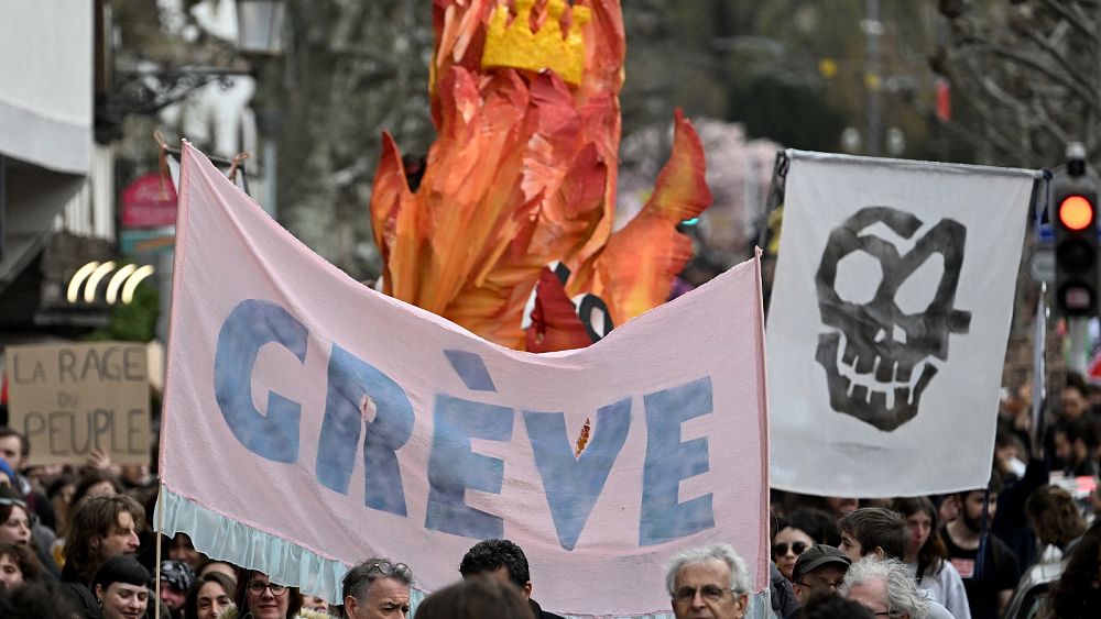 Mass strikes and protests grip France in defiance of Macron's pension ...