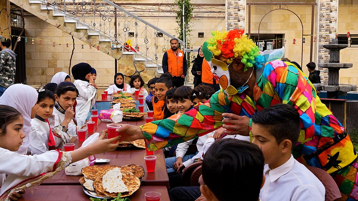 Meet the Syrian couple bringing joy to displaced children during ...
