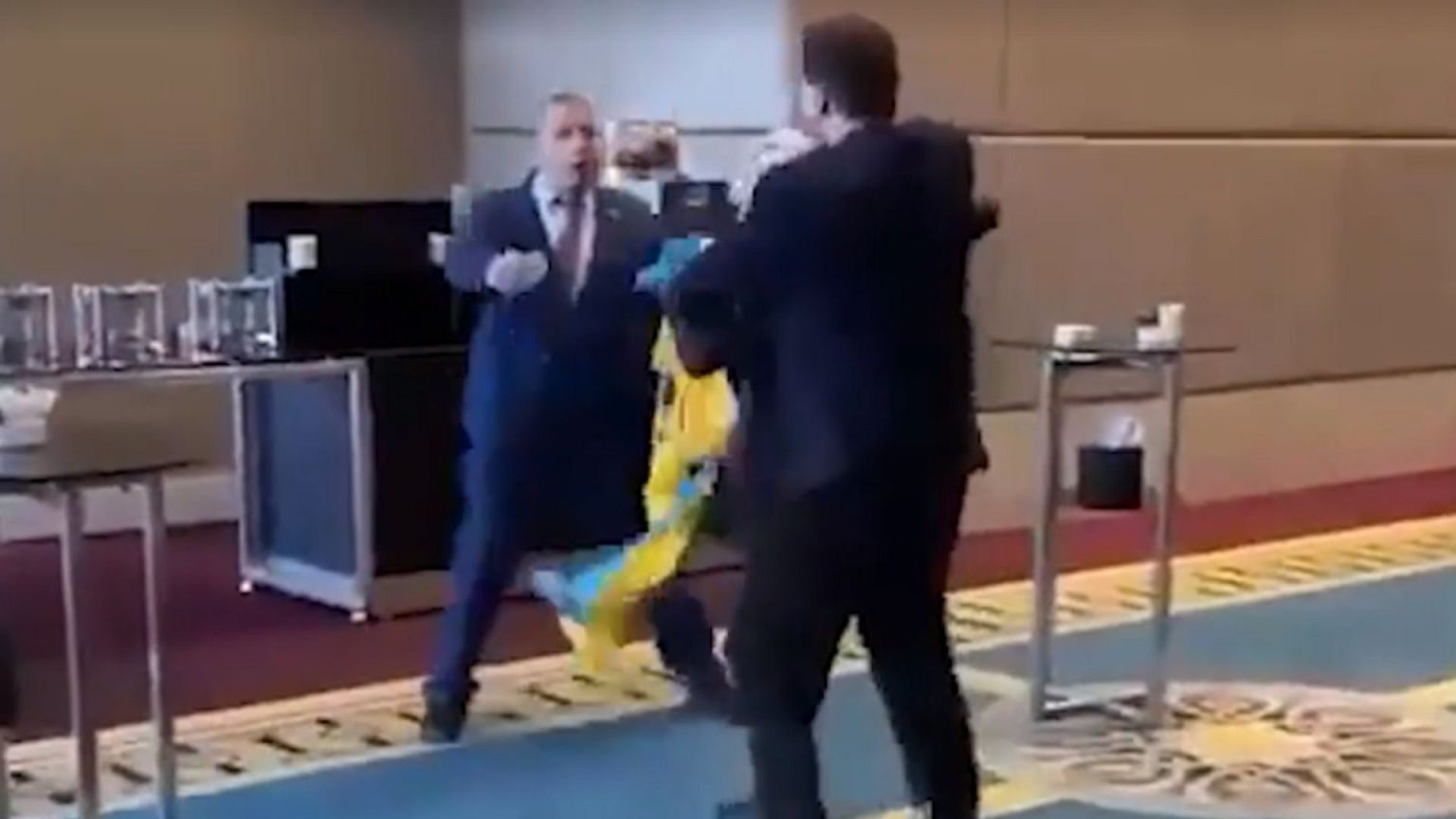 Watch: Ukrainian MP punches Russian politician in the head after flag ...