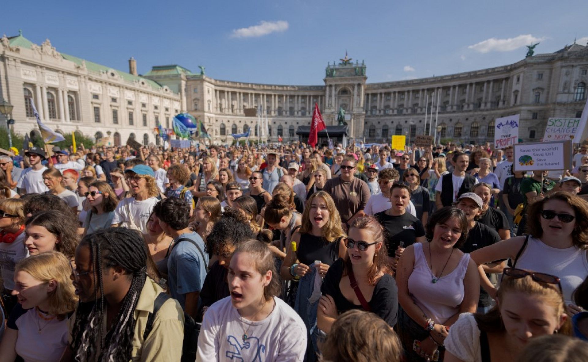 Activists spray the Brandenburg Gate orange as global protests call for ...
