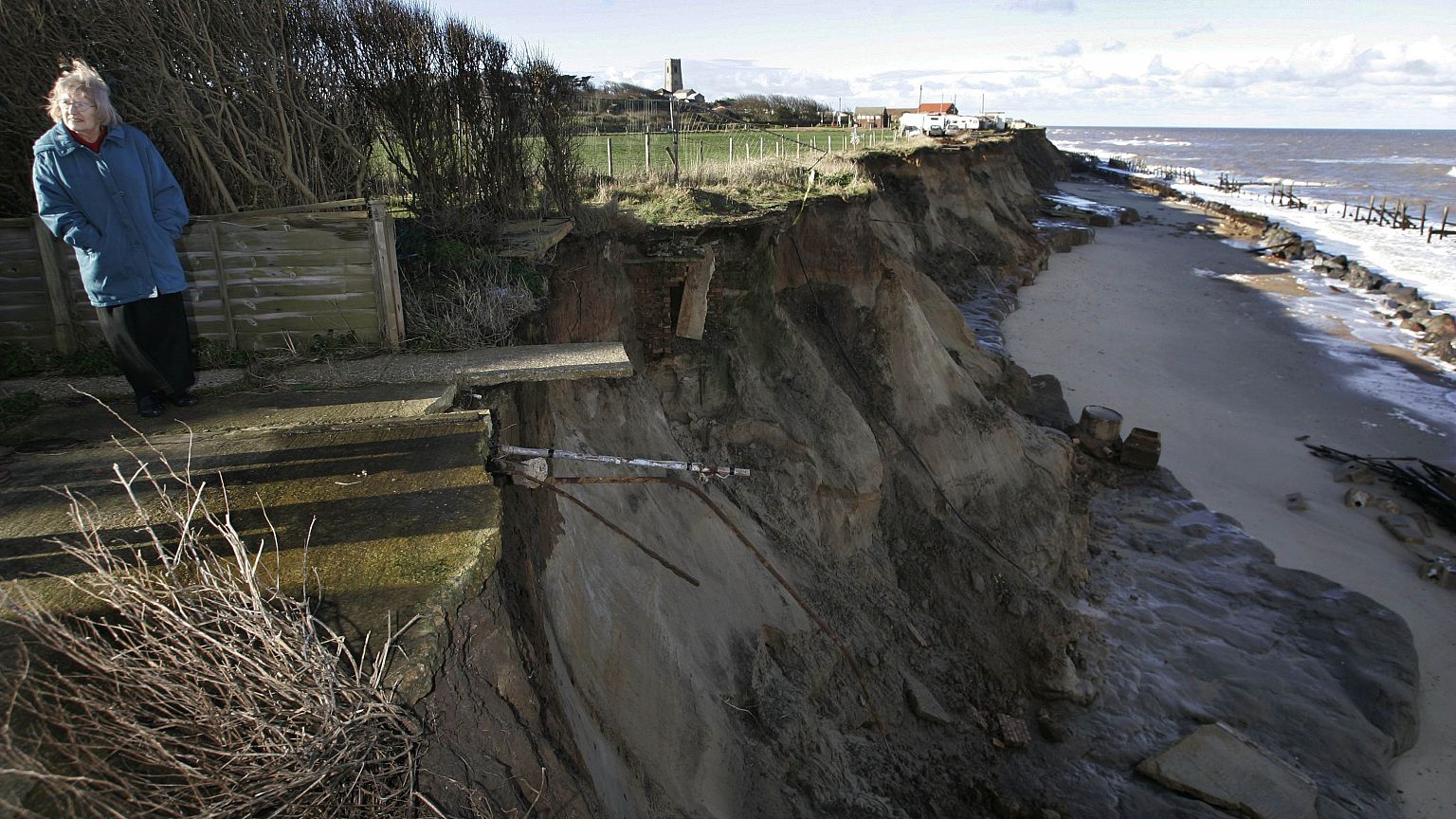 'Tearing this nation apart': Coastal erosion tears away homes in ...