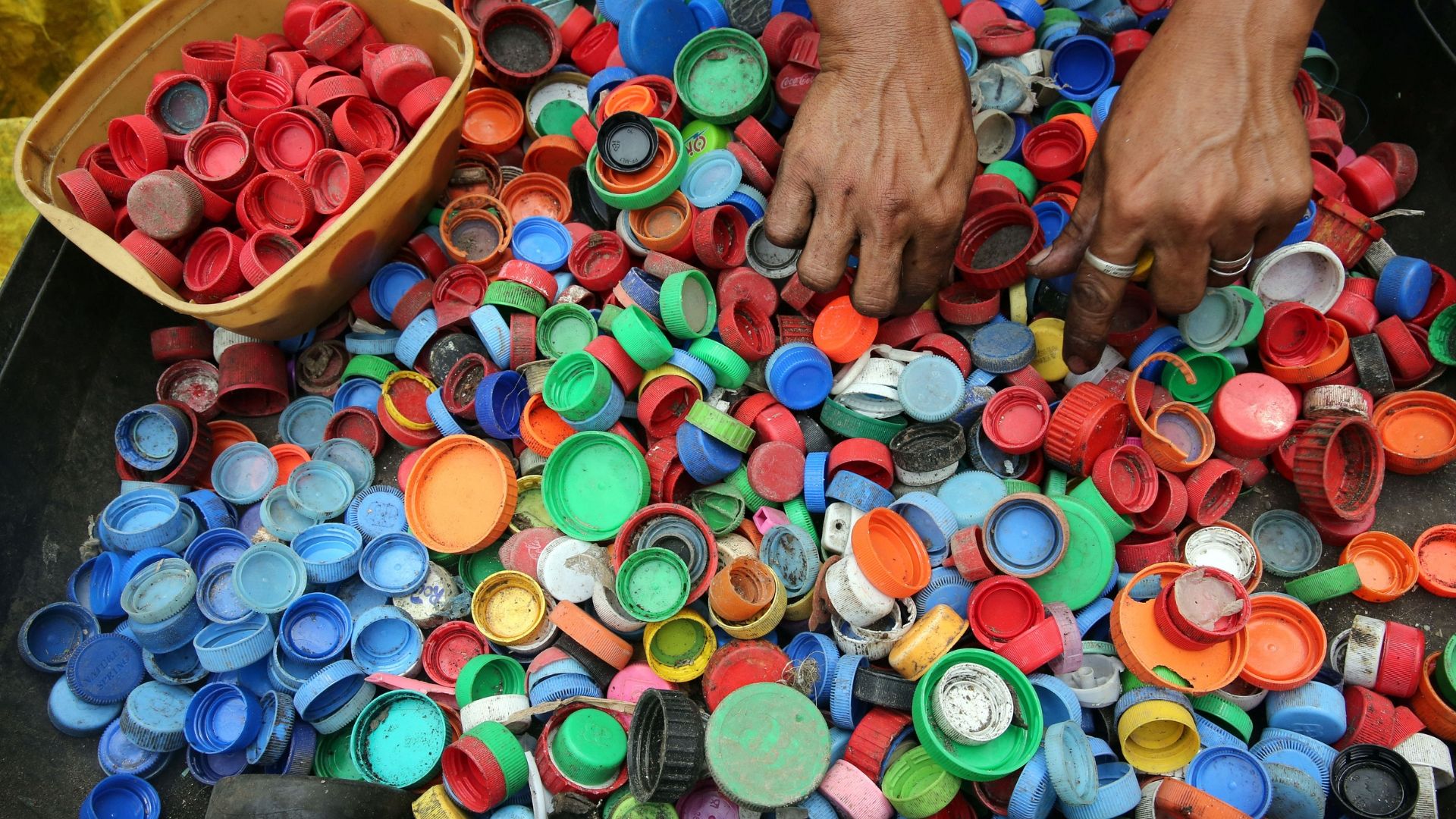 Bright colours make plastics break down faster, fuelling microplastic ...
