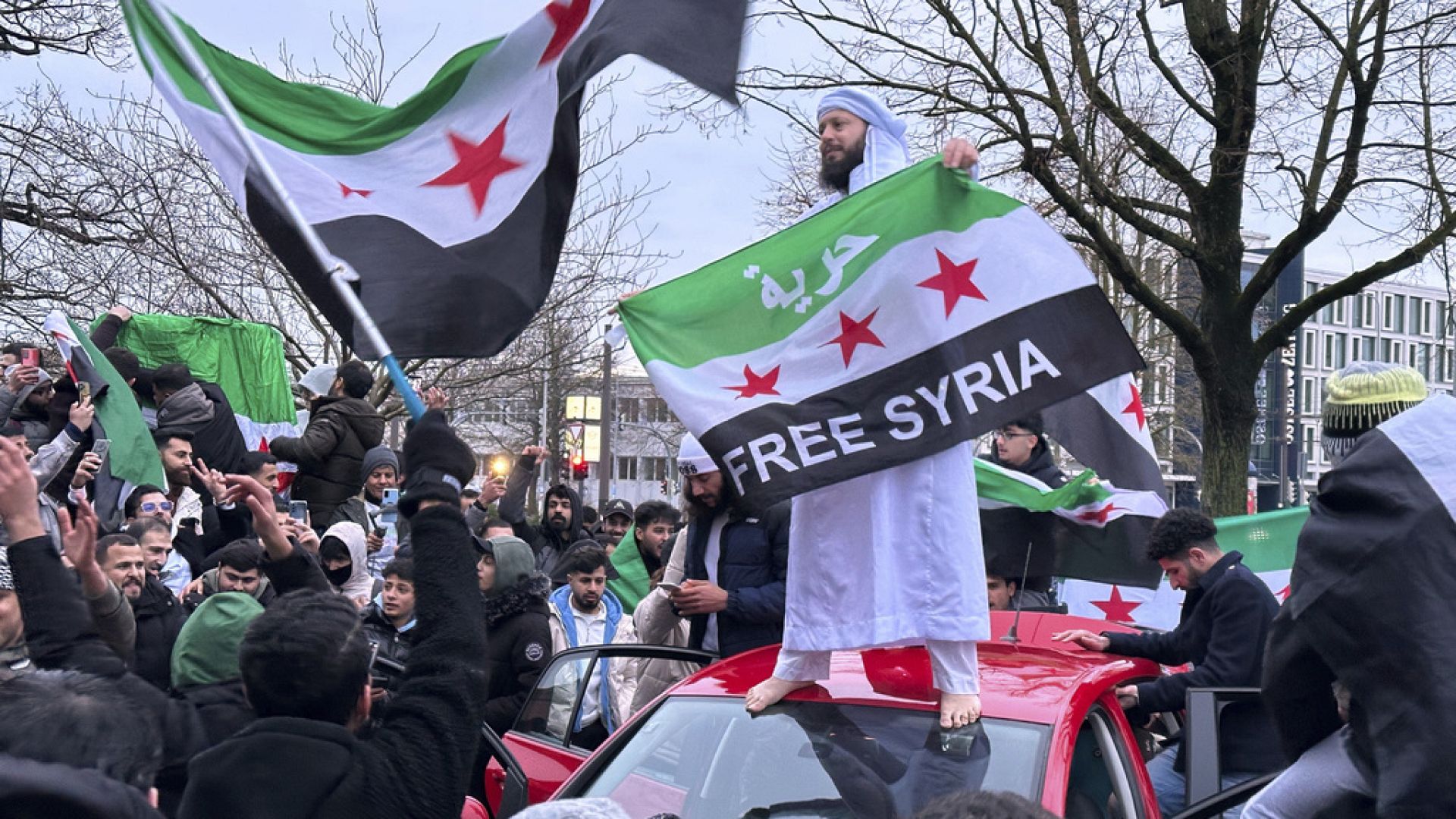 Germany and Austria freeze Syrian asylum applications, local media ...