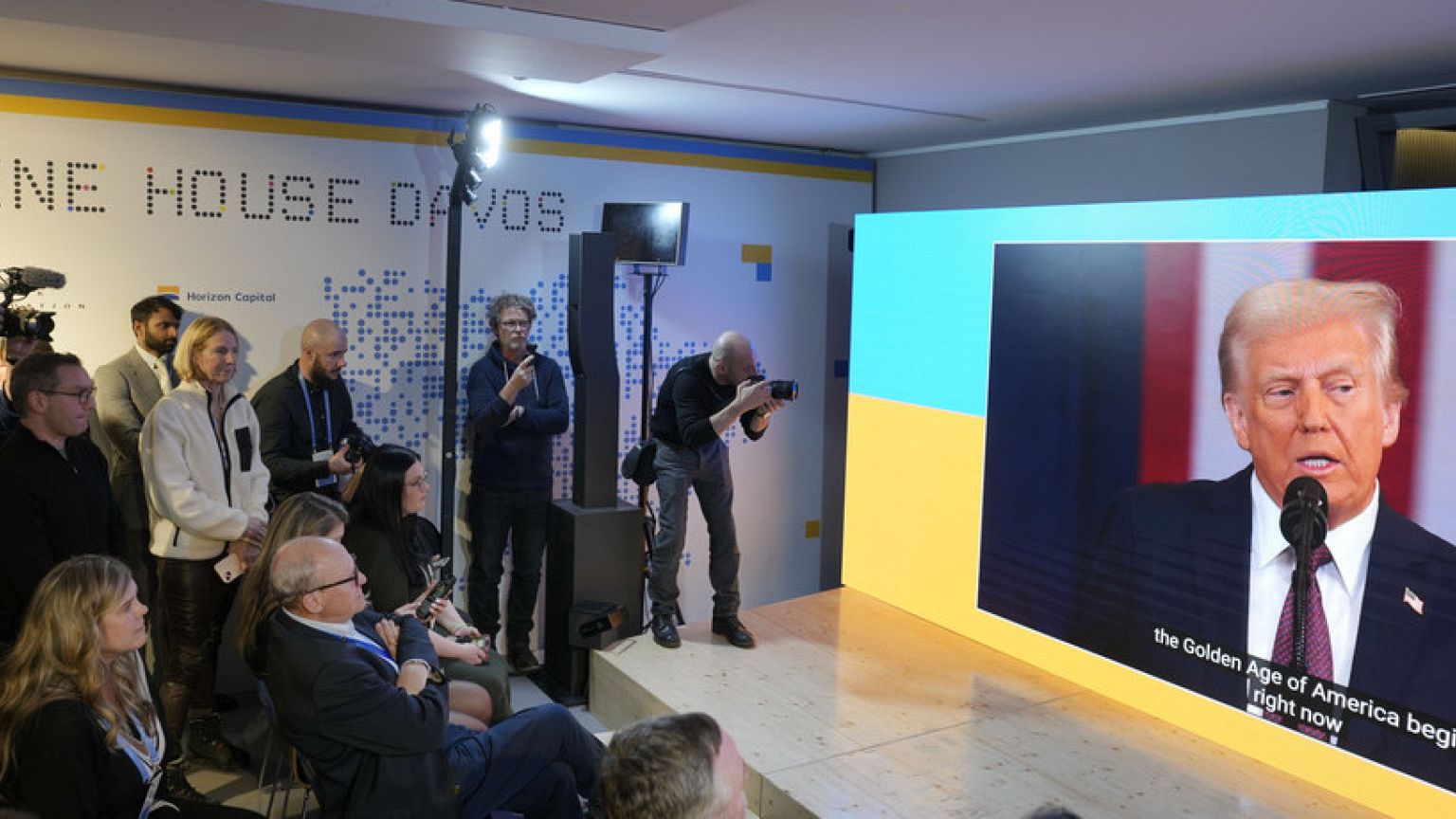 Davos attendees watch Donald Trump's inauguration at Ukraine House ...
