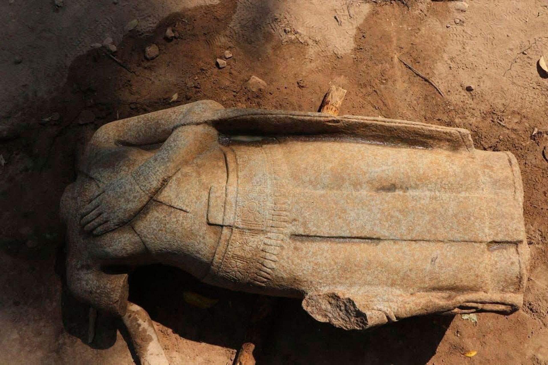 Missing torso of Buddha statue found at Cambodia's Angkor temple ...