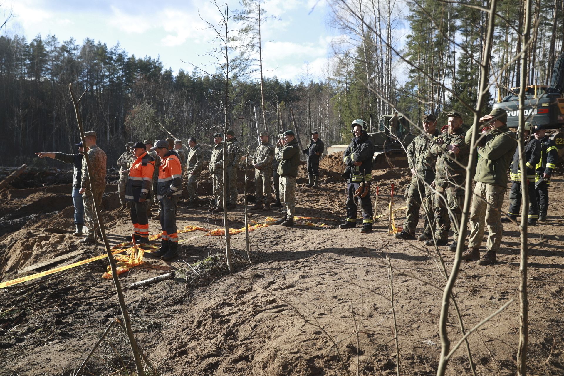 Troops struggle to drain Lithuania swamp to recover missing soldiers ...