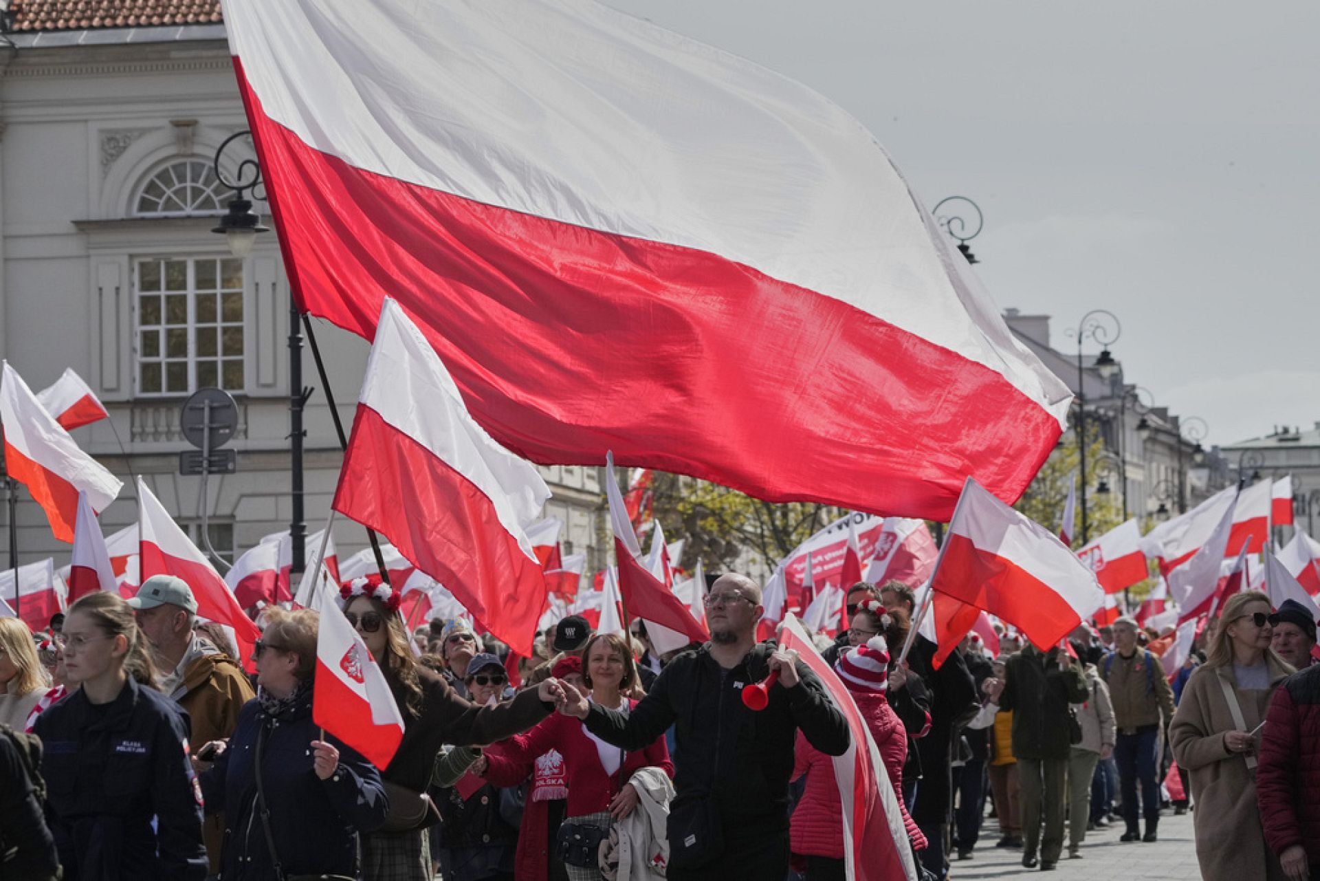 Thousands of Poles march to mark the coronation of the first Polish ...