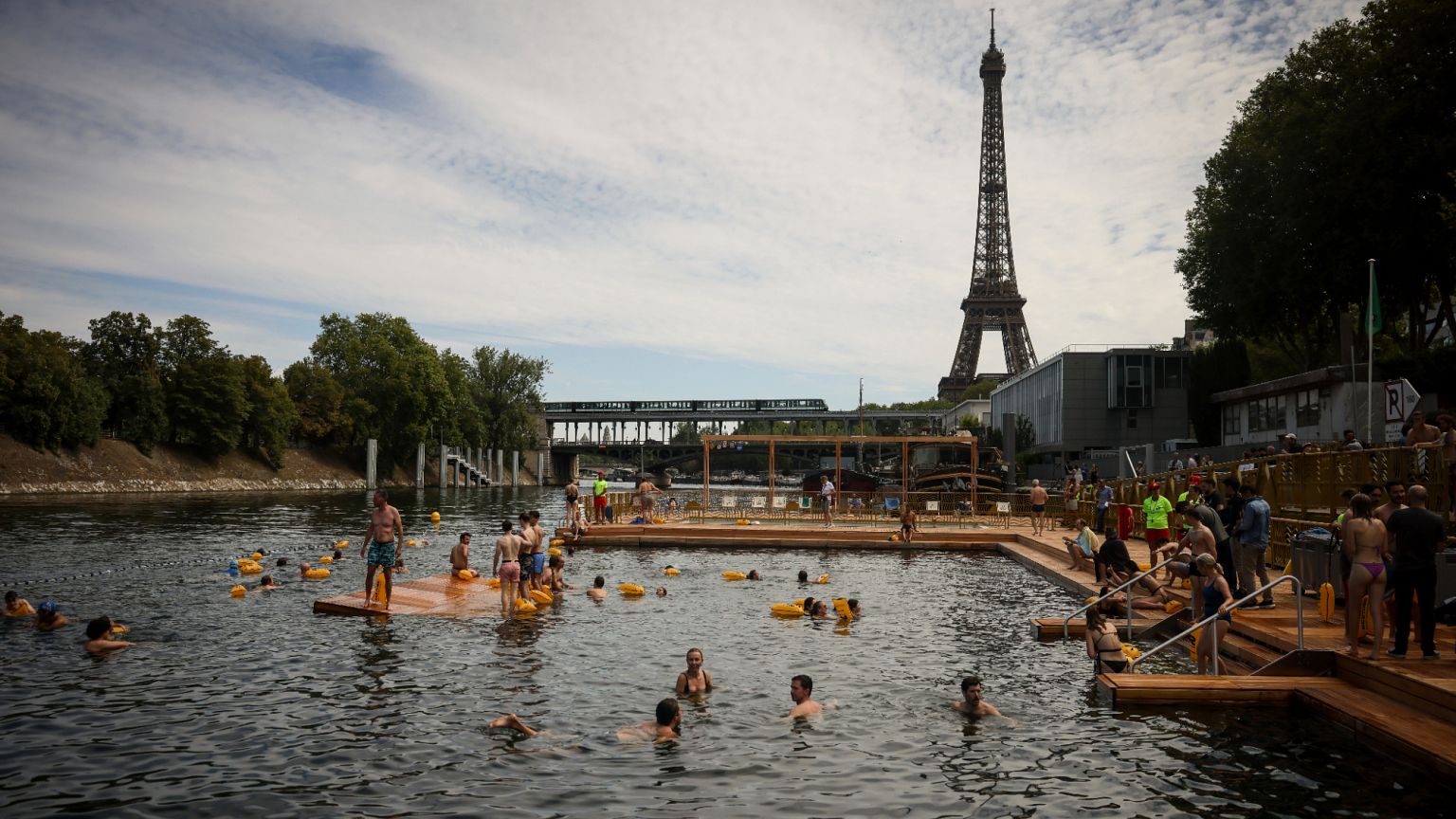 Parisians take a historic plunge into the River Seine after more than a ...