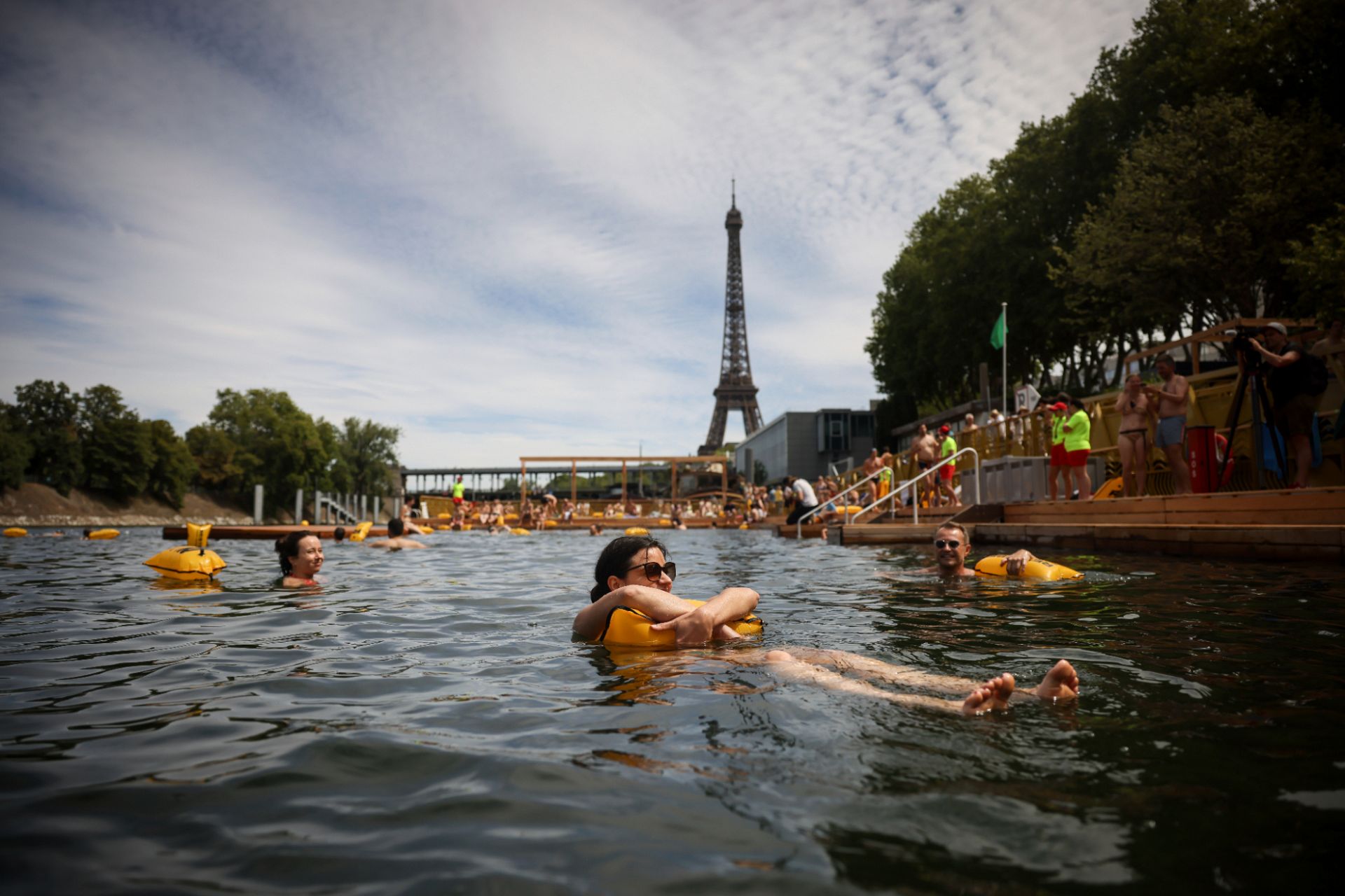 Parisians take a historic plunge into the River Seine after more than a ...