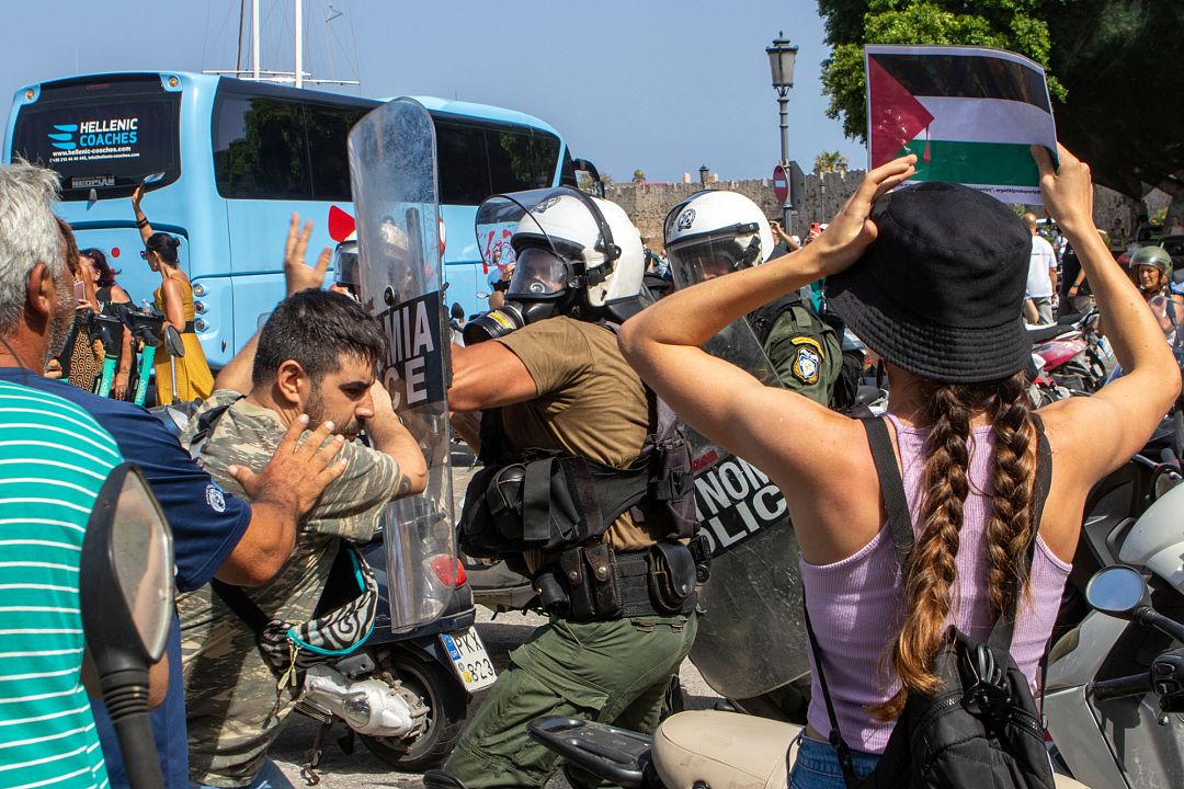 Riot police scuffle with demonstrators on Rhodes during visit by ...