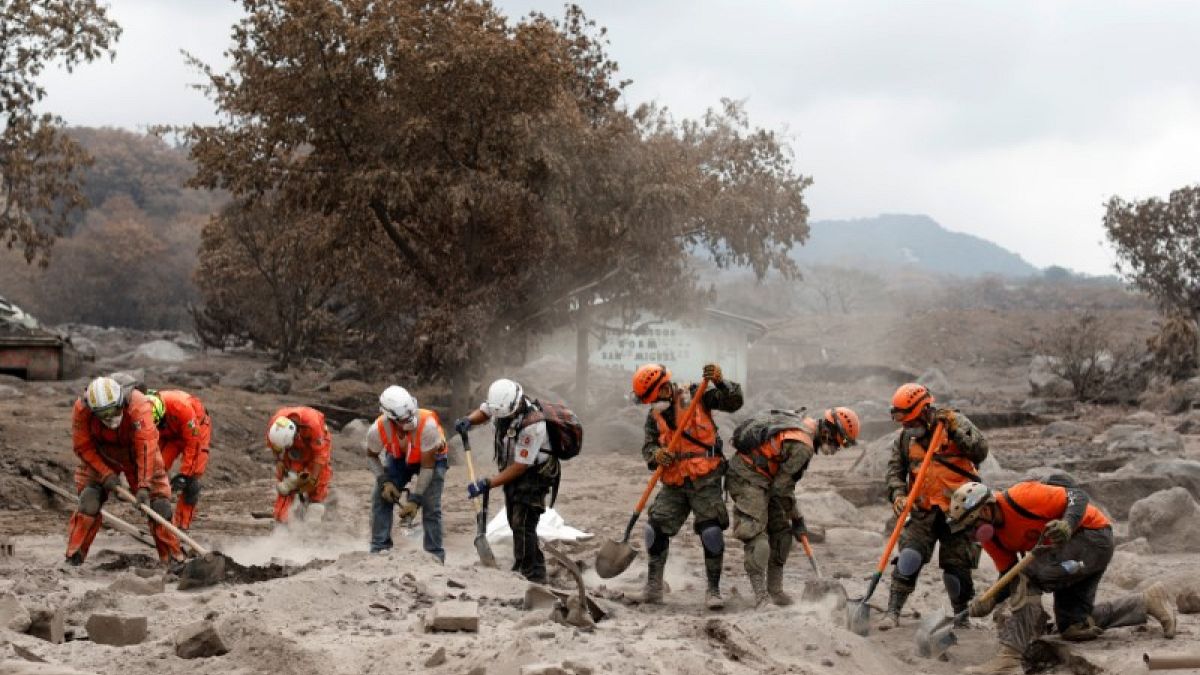 Lone woman digs for family lost under Guatemalan volcanic rubble | Euronews