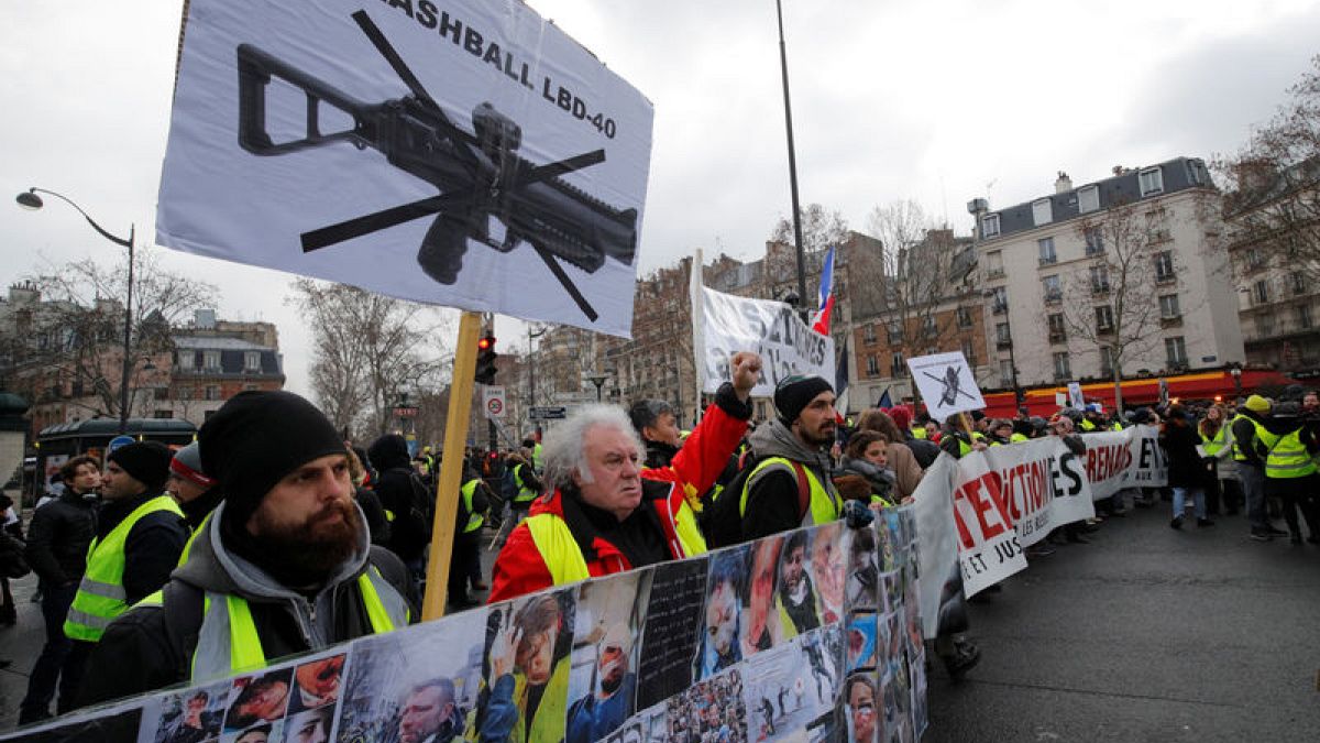 French 'yellow vests' march through Paris denouncing police violence ...