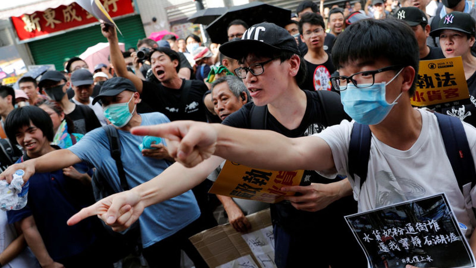 Hong Kong protesters, police clash as demonstrations target Chinese ...