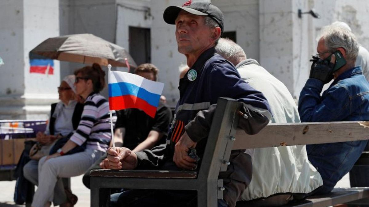 Life in Ukraine's post-siege Mariupol: barter markets and Russian TV ...