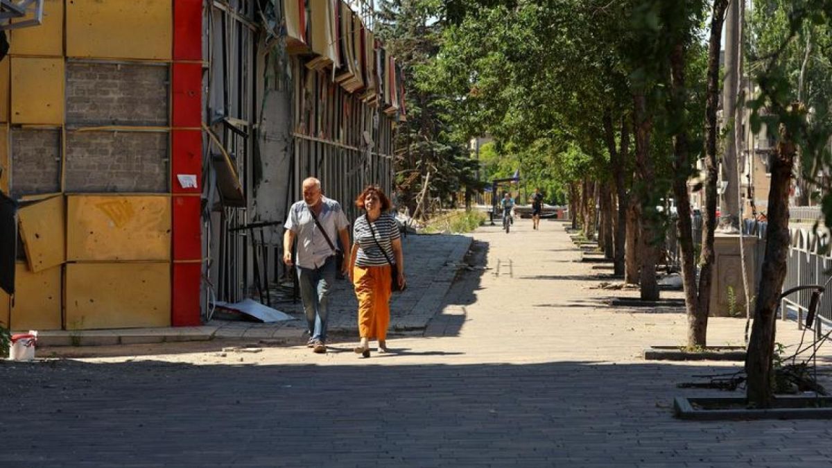 Residents of captured Ukrainian port city try to survive among its ...