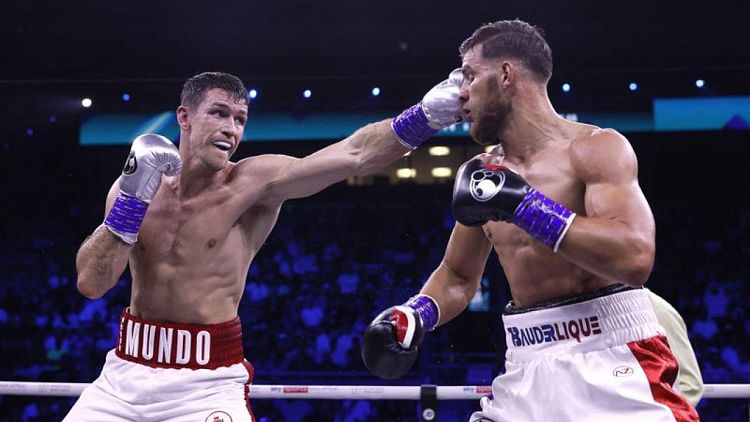 Boxing-Smith moves closer to becoming a two weight world champion ...