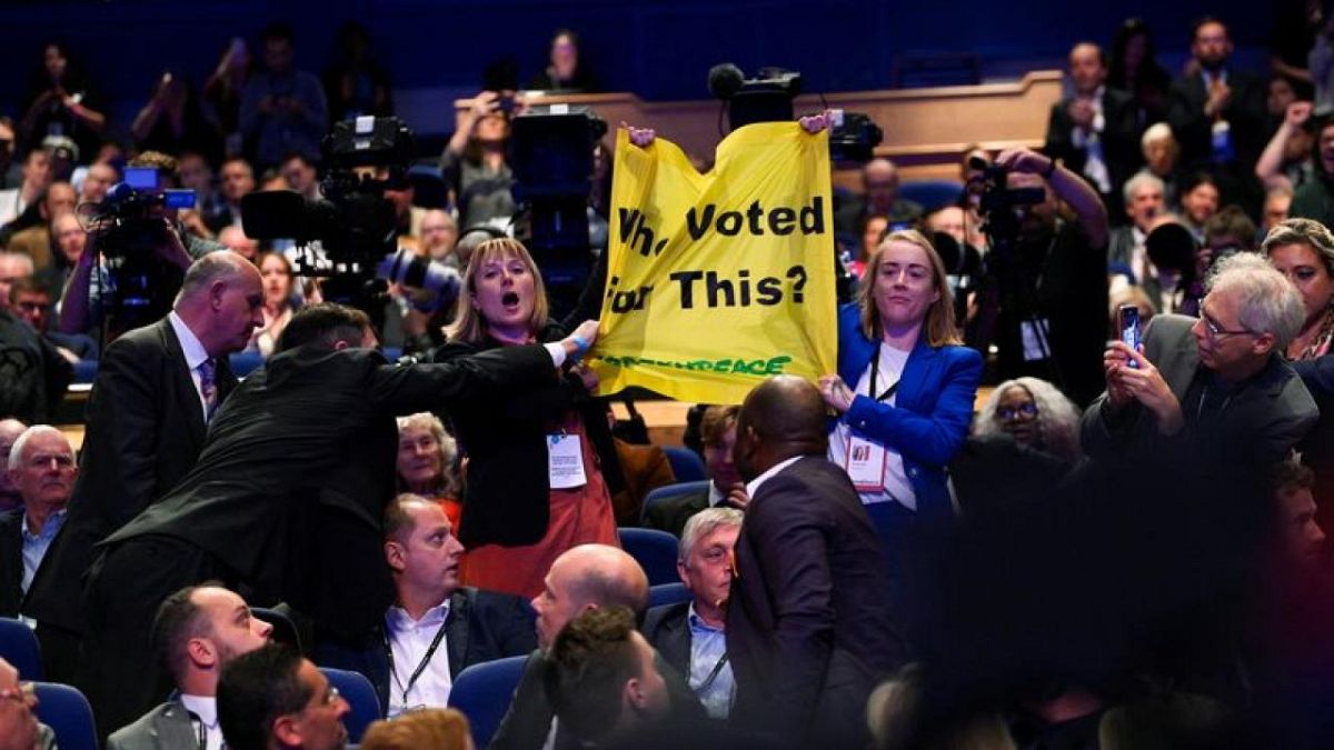 Greenpeace protesters interrupt UK PM Truss's speech at party ...