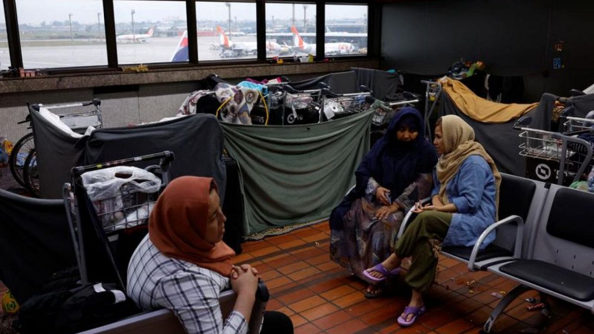 Afghan refugees camp out in Brazilian airport in search of new life ...